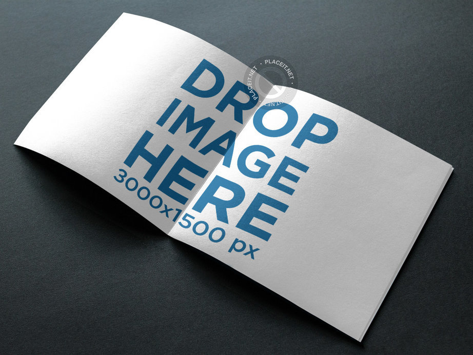 Placeit - Mockup of an Open Manual on a Black Surface