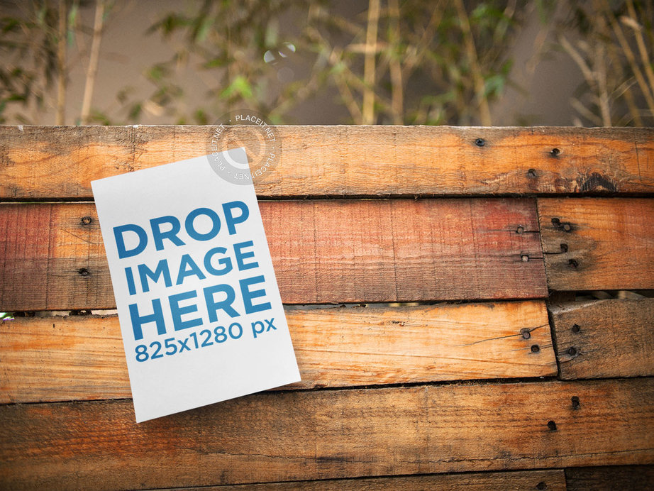 Placeit - Half Letter Flyer Template on a Wooden Surface Near Plants