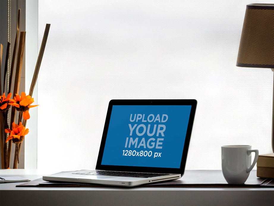 Placeit - Mockup of a MacBook Pro Placed Inside an Office