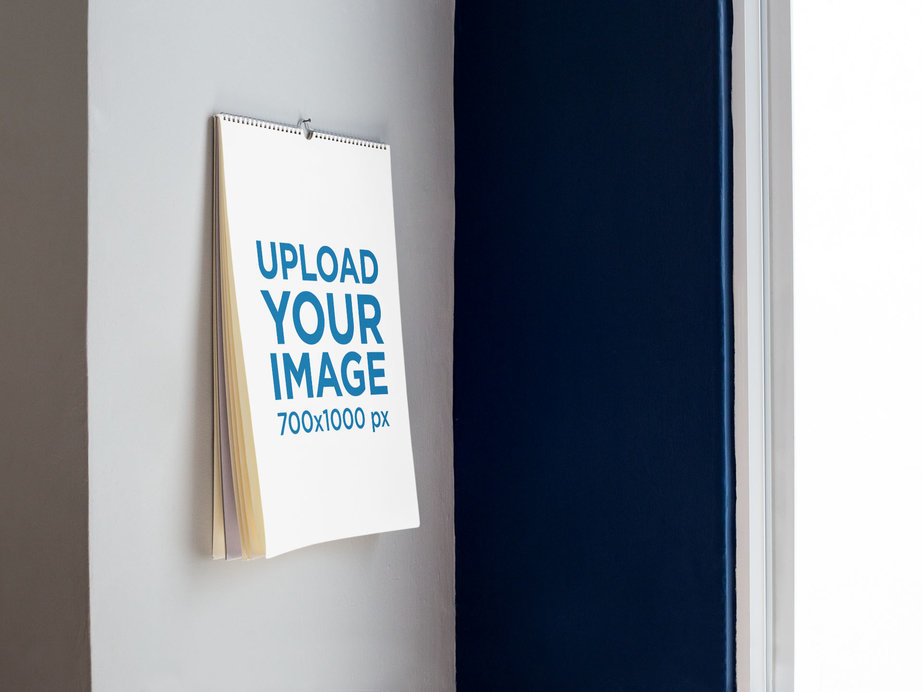 Placeit - Pinned Calendar Template on a Gray Wall