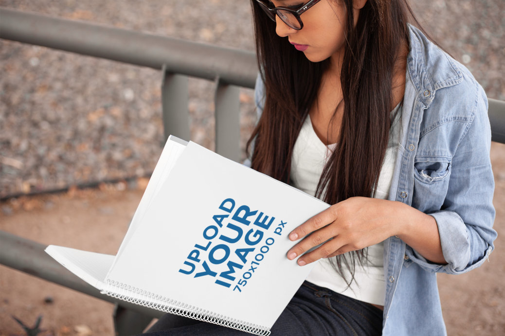 Placeit - Woman Reading Her Notes from a Spiral Notebook Template While ...