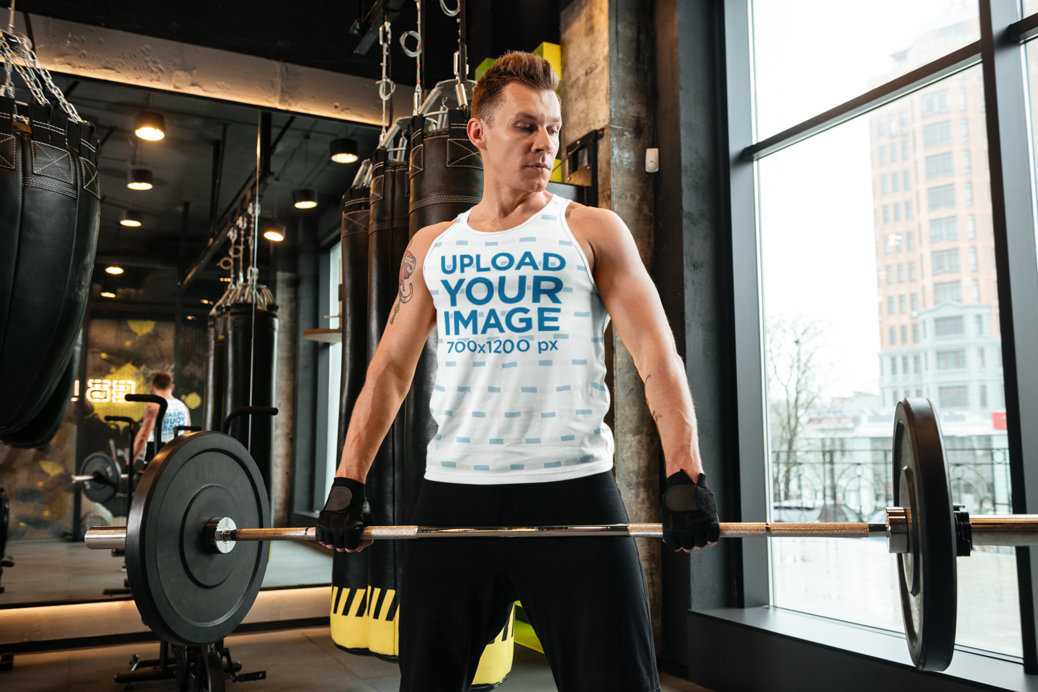 Placeit - Tank Top Mockup of an Athletic Man Lifting Weights