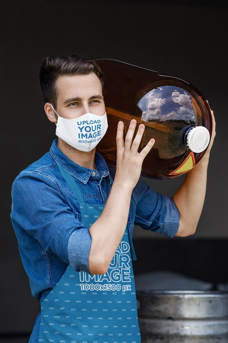 Placeit - Face Mask and Apron Mockup of a Man Carrying a Carboy