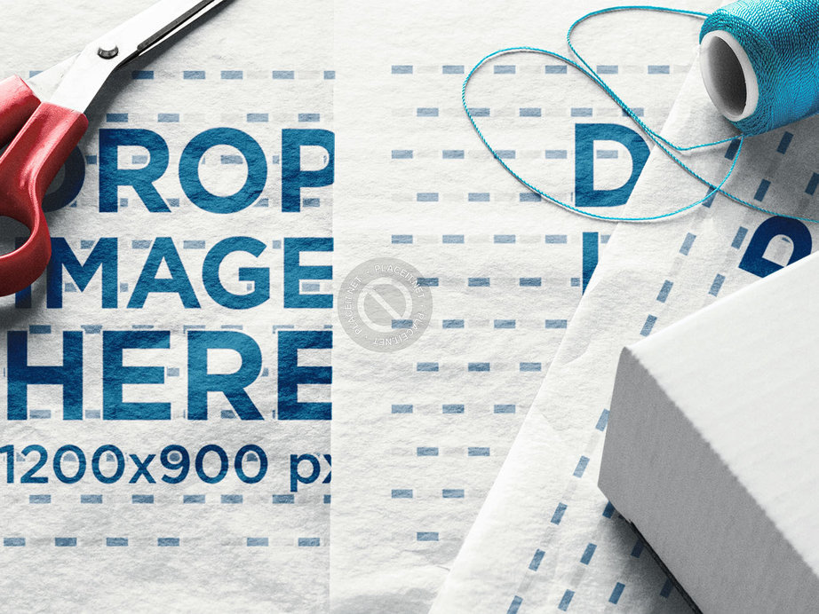 Placeit - Folded Wrapping Paper Template Lying with Scissors and Thread ...