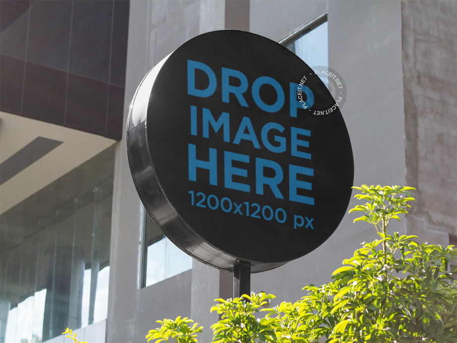 Placeit - Round Sign Mockup in an Open Mall Outdoors