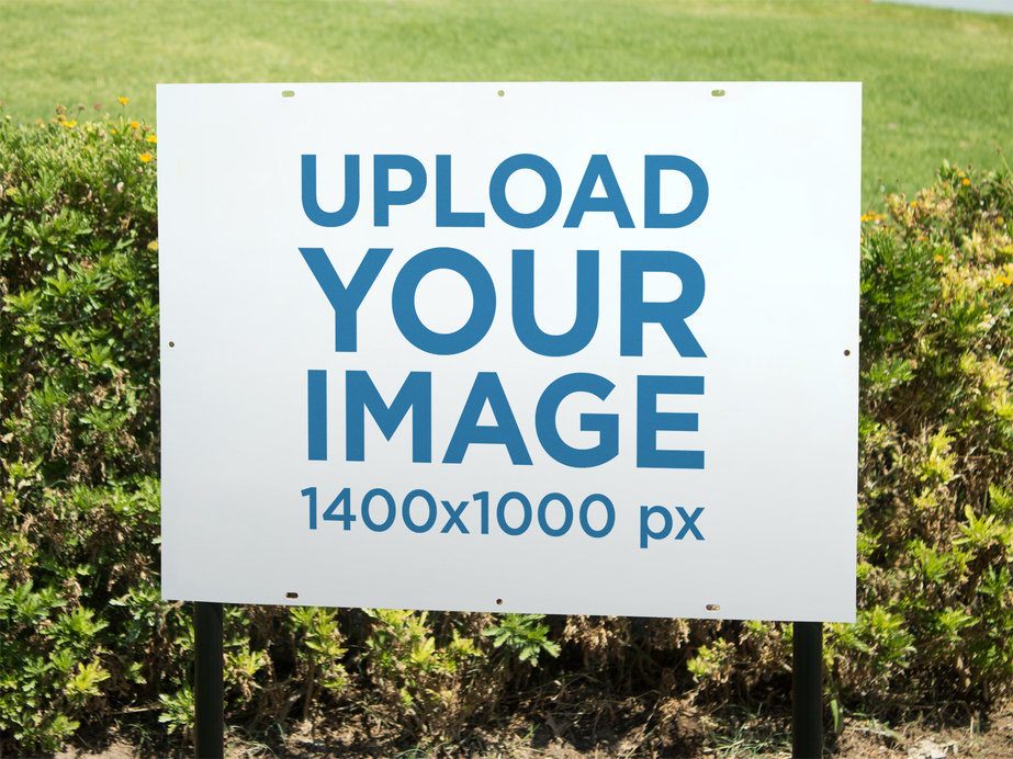 Placeit - Real Estate Lawn Sign Mockup Outdoors Near the Grass and a Bush