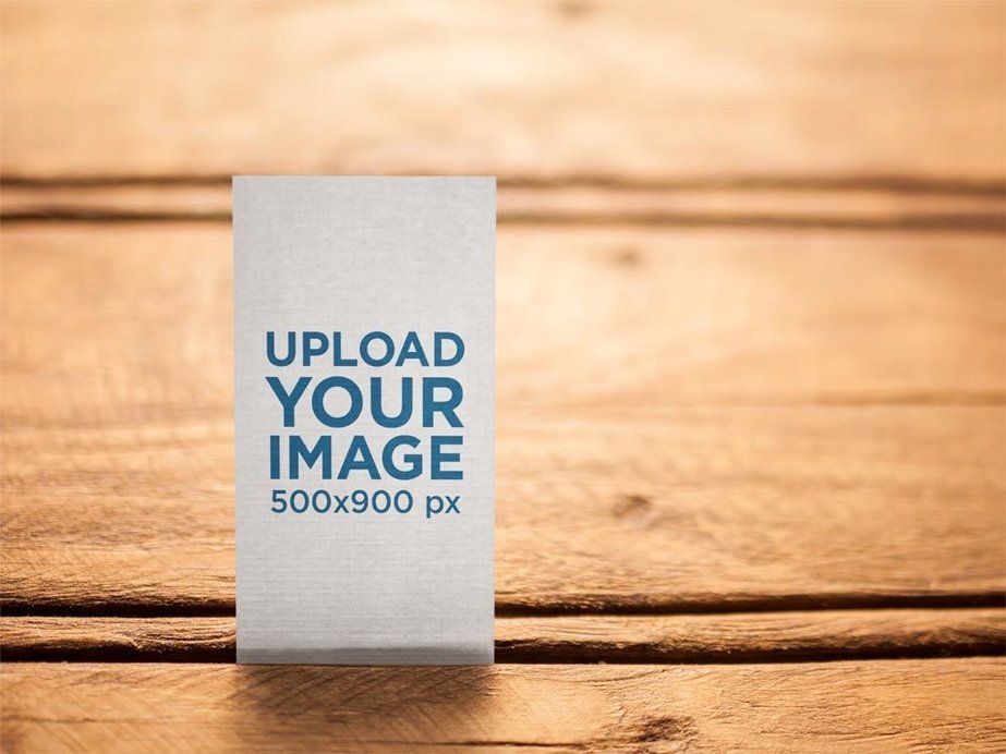 Placeit - Vertical Business Card Template Standing on a Wooden Surface