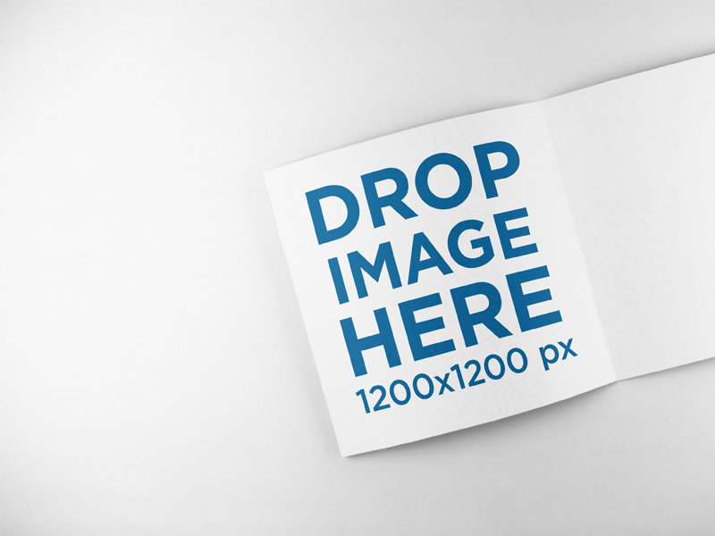 Placeit - Open Booklet Mockup Lying on a Solid Backdrop