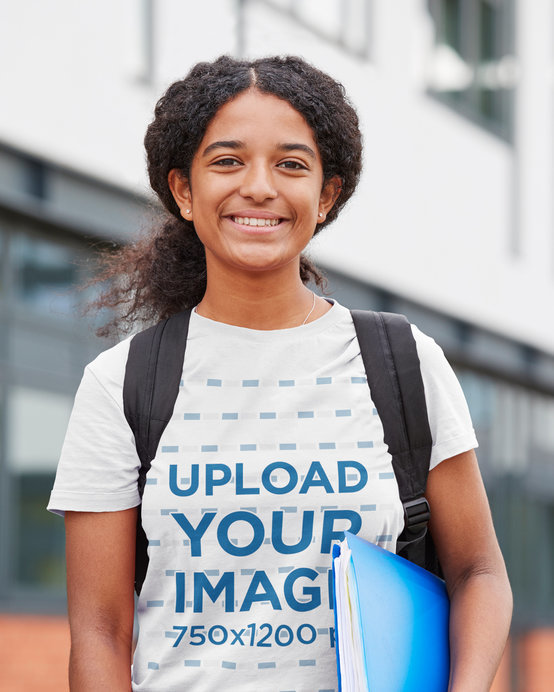 Placeit - Basic Tee Mockup of a Happy Female Student