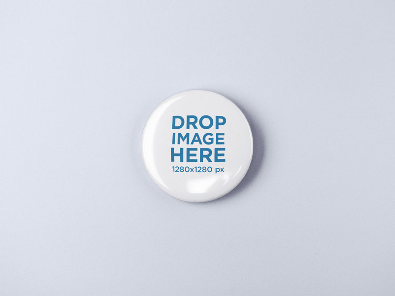 Placeit - Big Button Template Lying on a Solid Surface