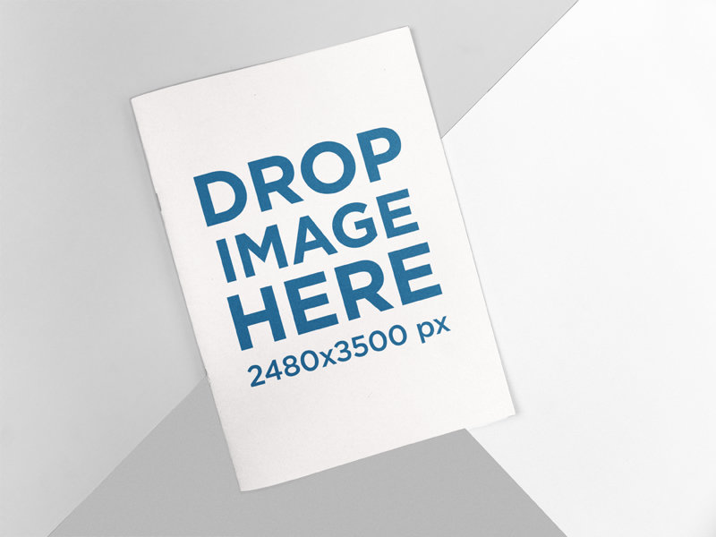 Placeit - Closed Booklet Template Lying on a Solid Surface With Three ...