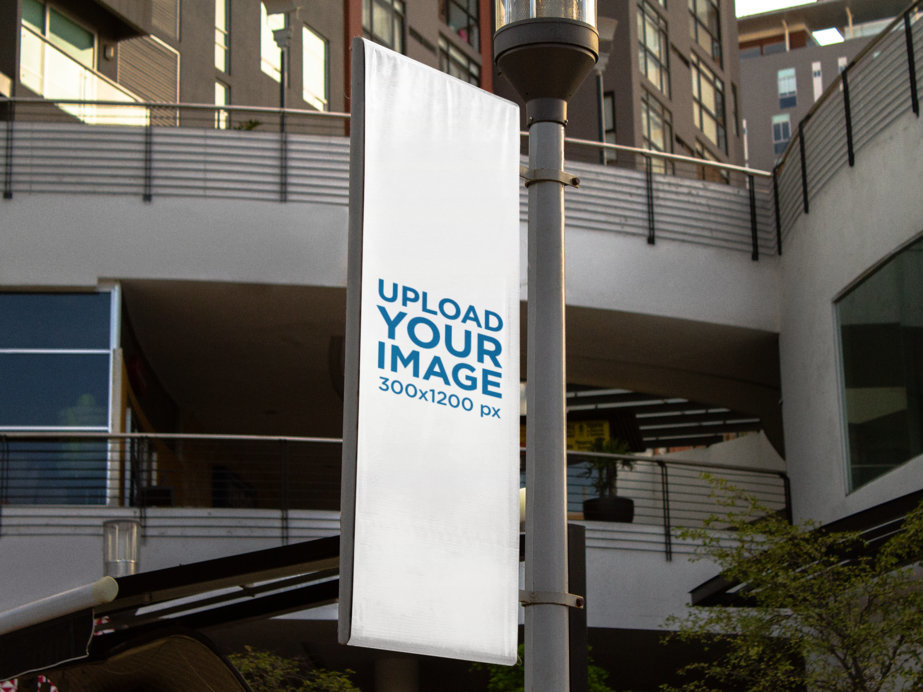 Placeit - Vertical Banner Template Hanging from a Light Pole Near a New ...