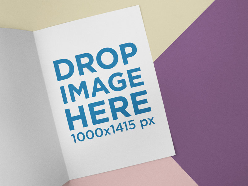 Placeit - Open Booklet Mockup Lying on a Tricolor Surface