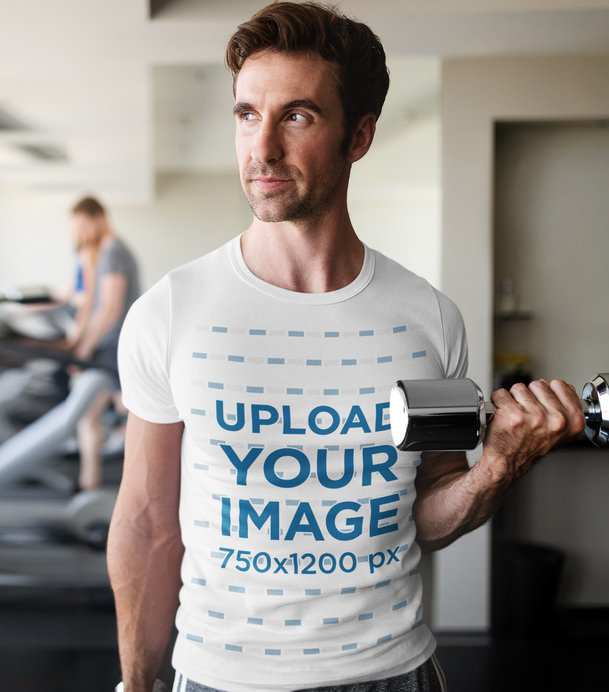 Placeit - T-Shirt Mockup of a Muscular Man Doing Bicep Curls at the Gym