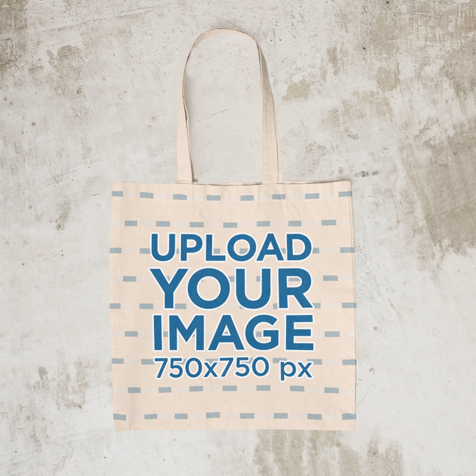Placeit - Mockup of an Empty Tote Bag on a Surface with a Raggedy Texture