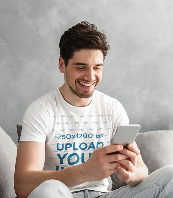 Placeit - Round Neck T-Shirt Mockup of a Man Reading a Funny Text Message