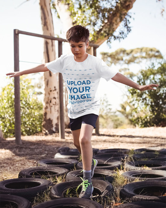 Placeit - T-Shirt Mockup of a Boy Going Through an Obstacle Course