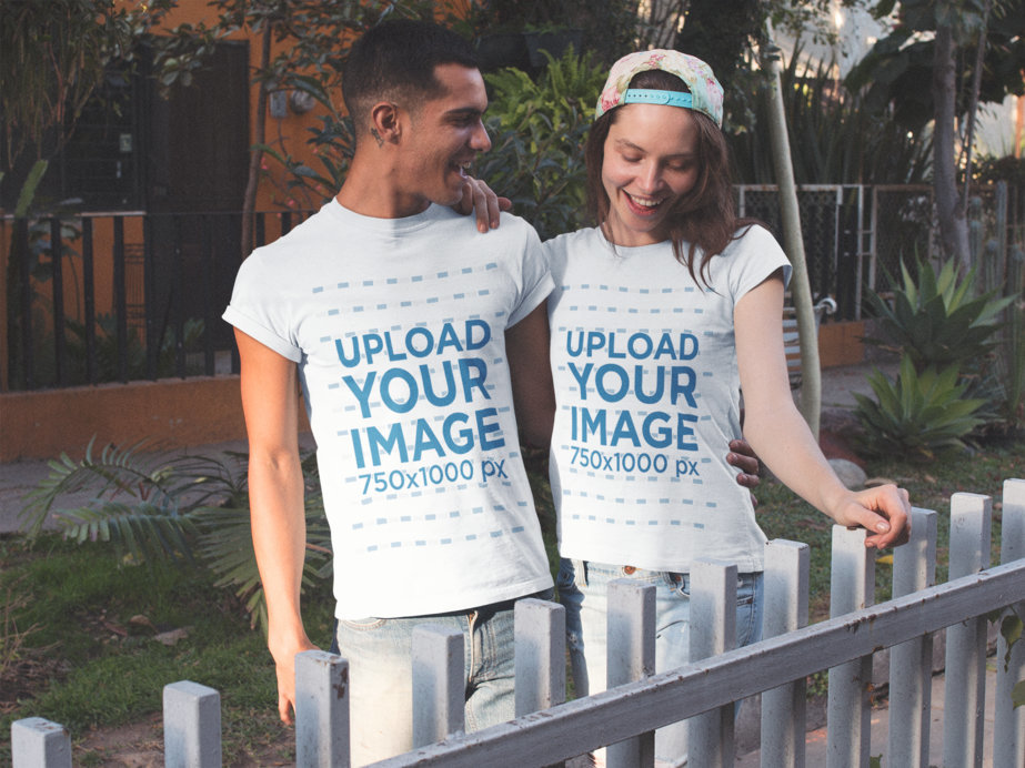Placeit - Couple Wearing Different Tees Mockup Walking Outdoors
