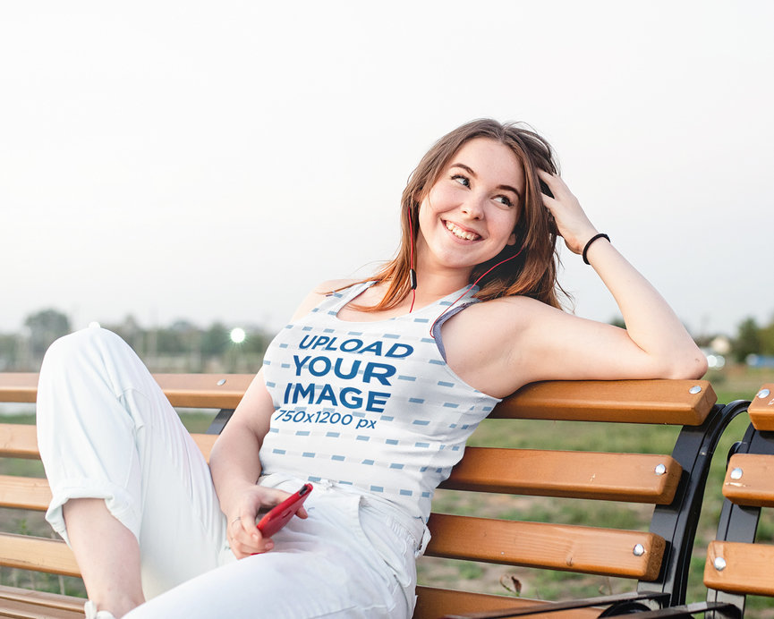 Placeit - Sublimated Tank Top Mockup of a Young Woman Sitting on a Bench