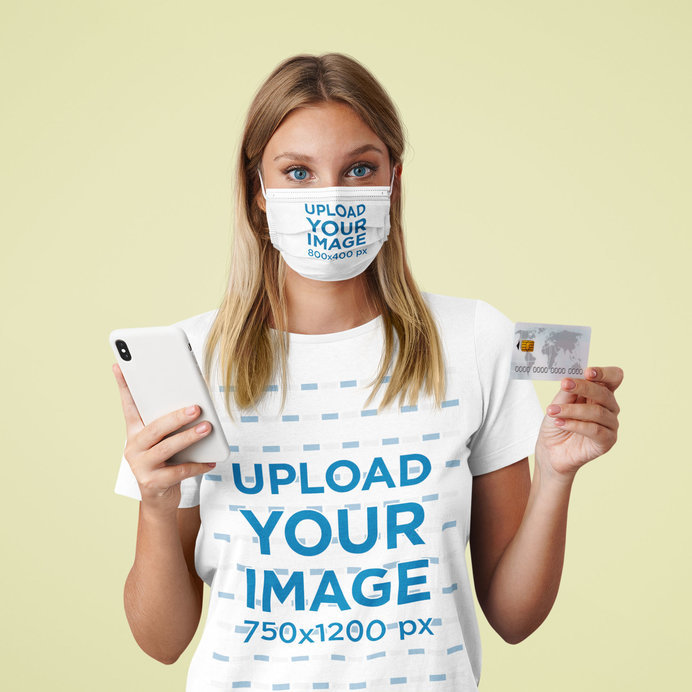 Placeit - T-Shirt Mockup of a Woman With a Face Mask Holding a Credit Card