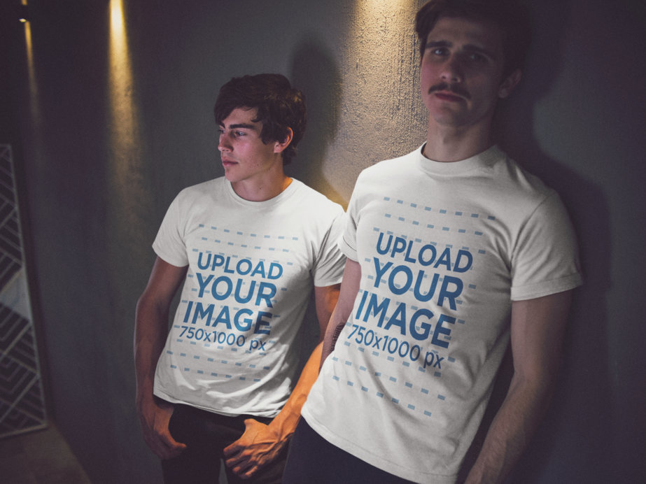Placeit - Two White Guys Lying Against a Concrete Wall in a Hallway ...