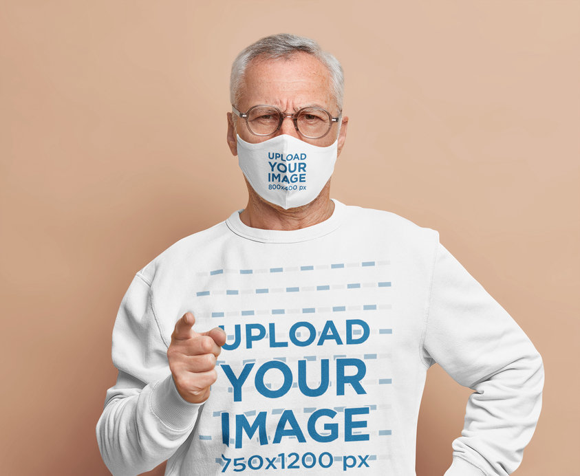 Placeit - Face Mask and Sweatshirt Mockup Featuring a Man Giving a ...
