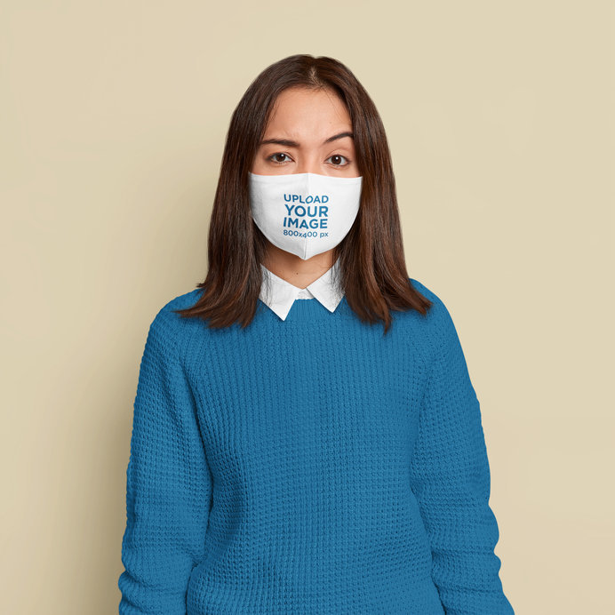 Placeit - Face Mask Mockup Featuring a Confused Woman Standing in a Studio