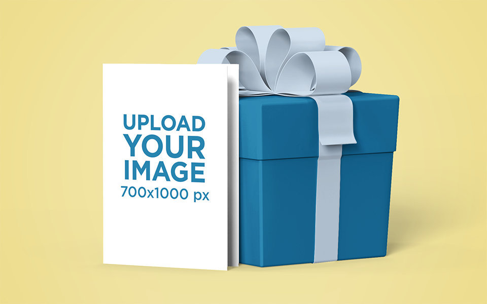 Placeit - Mockup of a Greeting Card Standing Next to a Gift