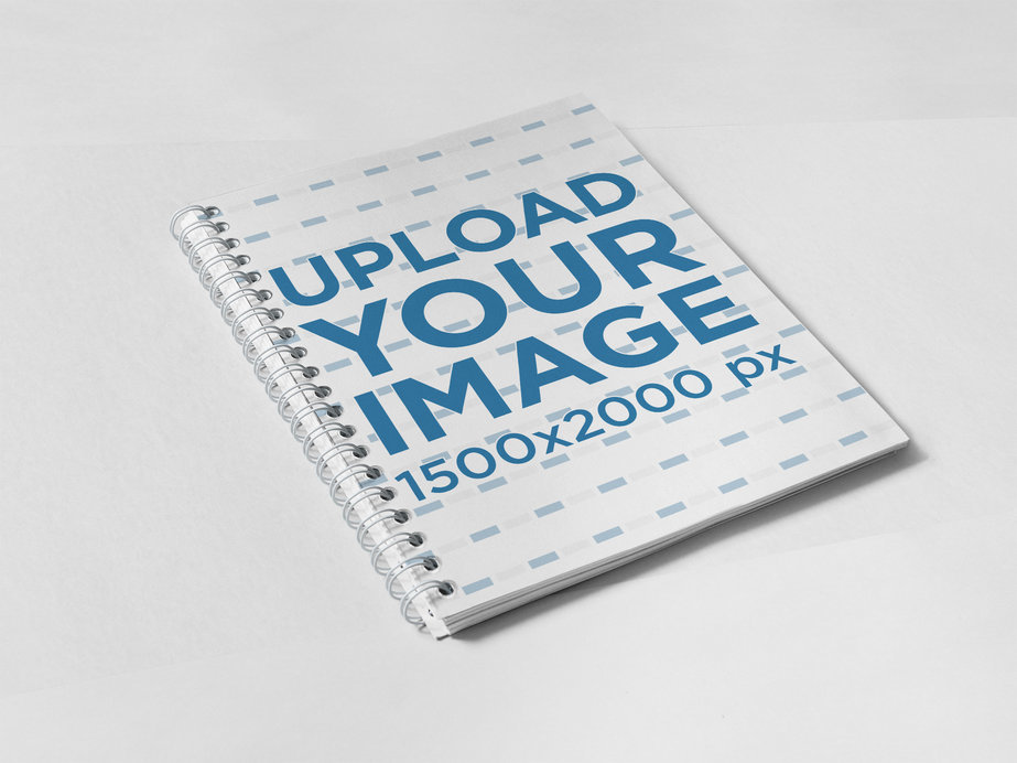 Placeit - Mockup of an Angled Spiral Notebook Lying on a Three Colors ...
